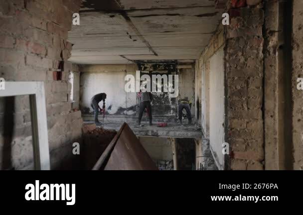 Team cuts reinforcement in debris-filled building for urban renewal ...