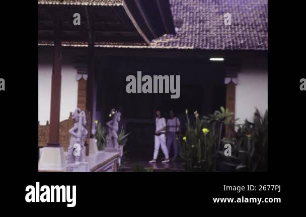 Denpasar, bali june 1985: tourists exploring a traditional balinese art ...