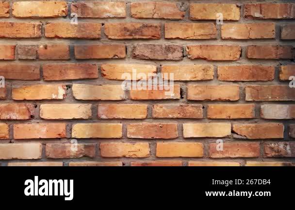 a vintage old red brick wall video captures the weathered texture and ...