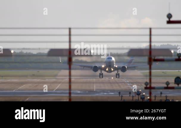 Aircraft take off, view from the end of the runway. Retracting, closing ...