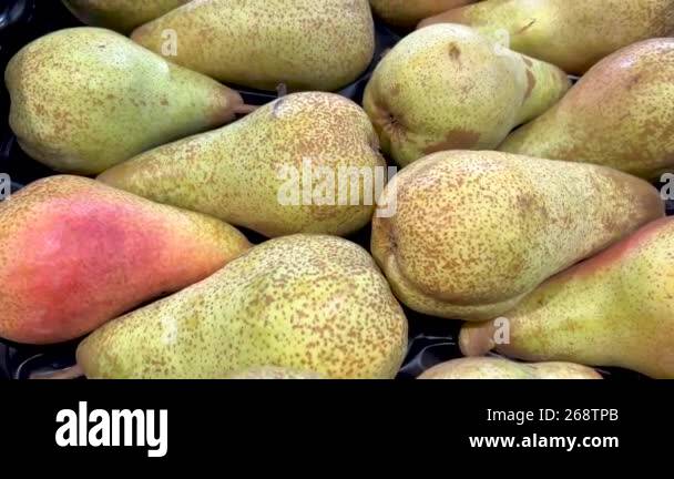 Abate Fetel pears displayed at the greengrocer's, tracking shot in top ...