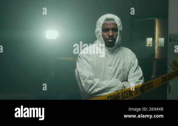 Medium lowkey portrait of young African American male forensic expert ...