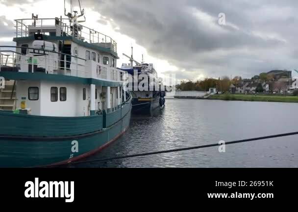 Boats moored at the dock. Muirtown Basin Marina on the Caledonian Canal ...