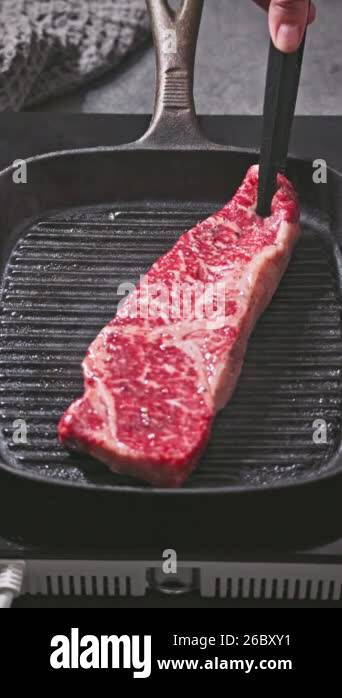 delicious juicy wagyu beef steak meat cooking on a grill pan. Process ...