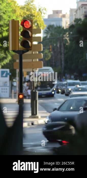 Traffic light turning red in a city. 05/09/2024, Malaga, Spain. 4K ...