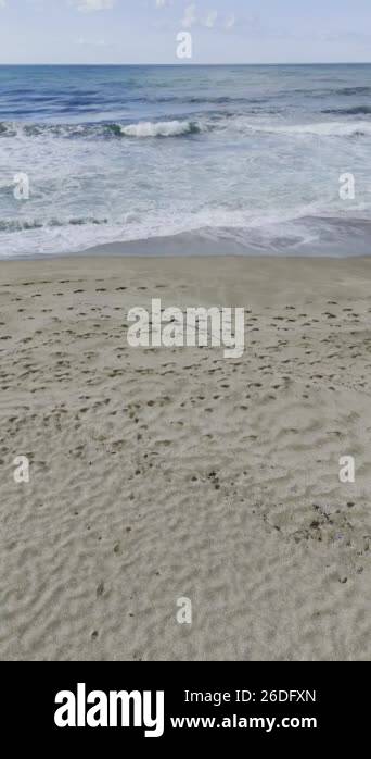 Waves sandy beach. High quality 4k footage Stock Video Footage - Alamy