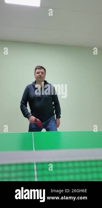 Skilled amateur demonstrating professional table tennis techniques and ...