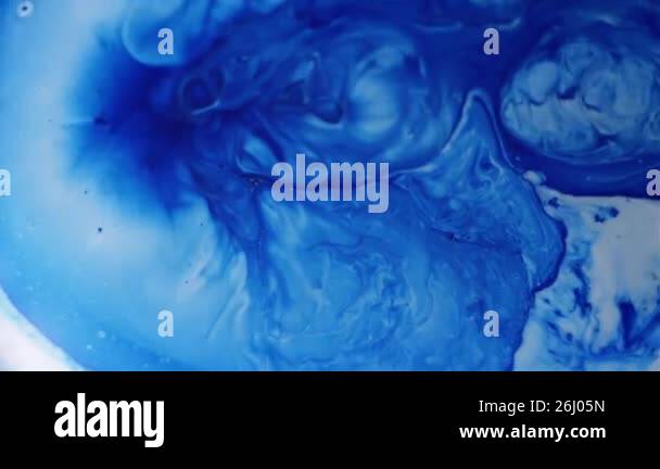 Ink bleed. Dye explosion. Liquid art boiling white blue smooth wave ...