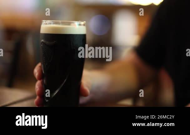 Sequence of a beer pint being poured and served Stock Video Footage - Alamy