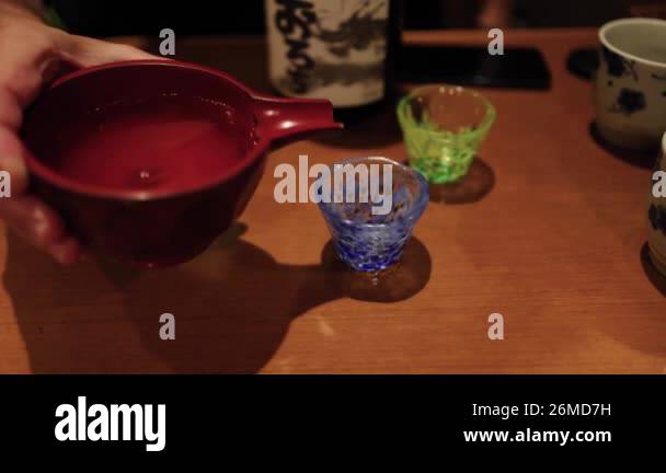 Sequence of pouring tea from a red teapot Stock Video Footage - Alamy