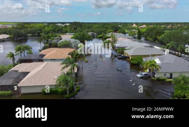 Aftermath of hurricane Debby flooding natural disaster. Boat floating ...
