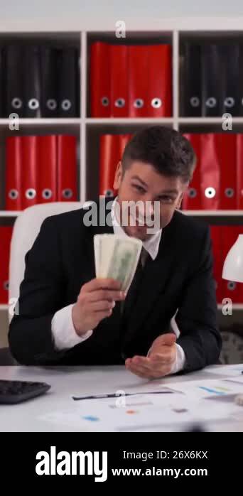 4k Ultra HD. Young successful Businessman throwing up money dollars ...