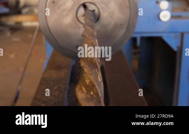 Twisted metal square rod. The rod is placed in a hydraulic torsion ...