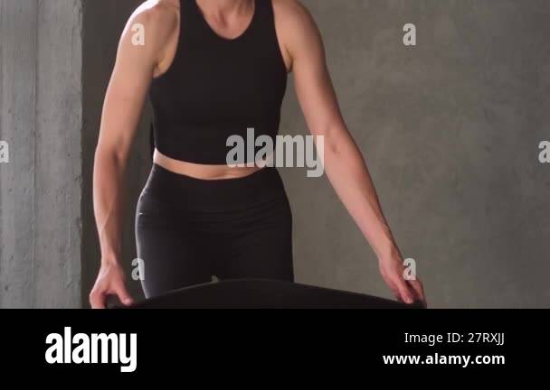 Physical practice. Fitness workout. Athletic woman in activewear unroll ...