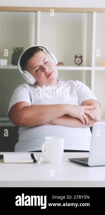 Vertical video. Sleepy employee. Overworked manager. Tired overweight ...