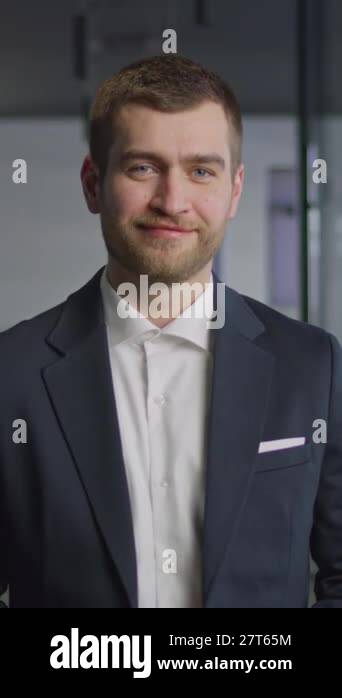 Vertical Screen: Professional portrait of a confident young businessman ...