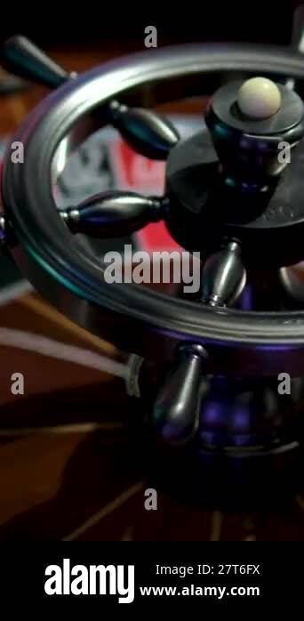 A close-up view of an antique roulette wheel spinning, revealing the ...