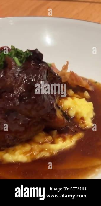 Delicious tender beef cheecks with creamy polenta and vegetables, fancy ...