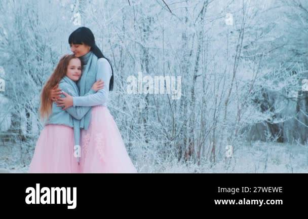 Beautiful woman mom hugs cute pretty little girl daughter. Family ...