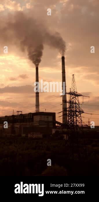 Dangerous industry pollutes the atmosphere. Harmful factory with large ...