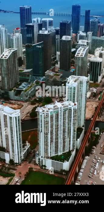 Flying above the beautiful high-rise buildings in the cityscape on the ...