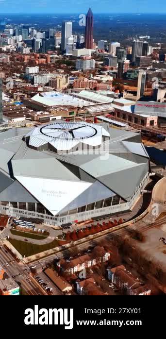Gorgeous round building of Mercedes-Benz Stadium in the city scenery of ...