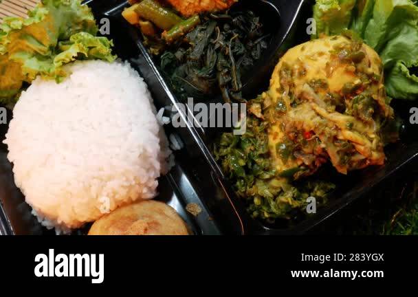 Close up Nasi Padang complete in black box is a traditional food from ...