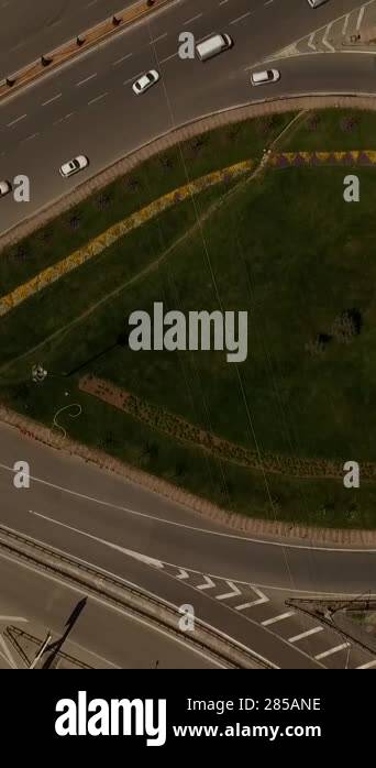 This is a view of a drone flying in city traffic, an aerial view of ...