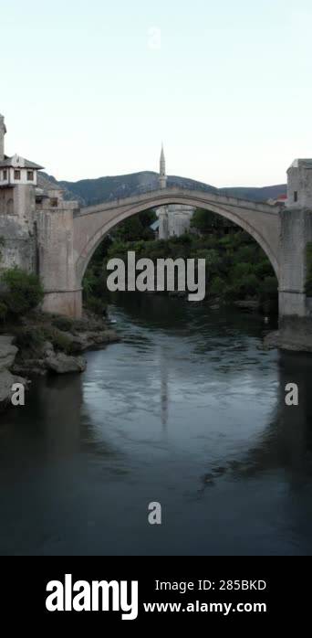 Drone view of Mostar Bridge made of historical stone, Ottoman ...