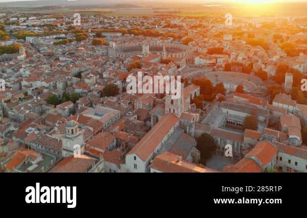 Cityscape of Arles at sunrise, southern France. HIstoric buildings ...
