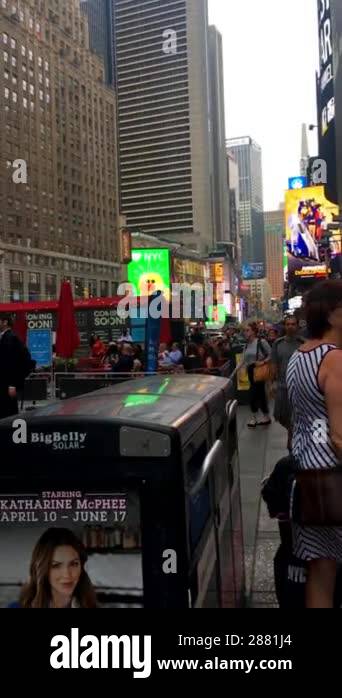 A bustling crowd at Times Square in Manhattan, New York City, captured ...