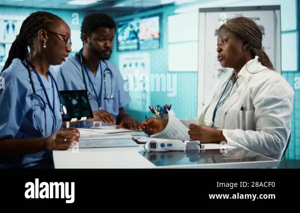 African american medical staff preparing before a consultation in an ...