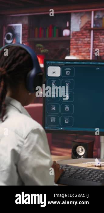 Vertical video Woman at home using AI software turning text prompt into photos, drinking coffee ...