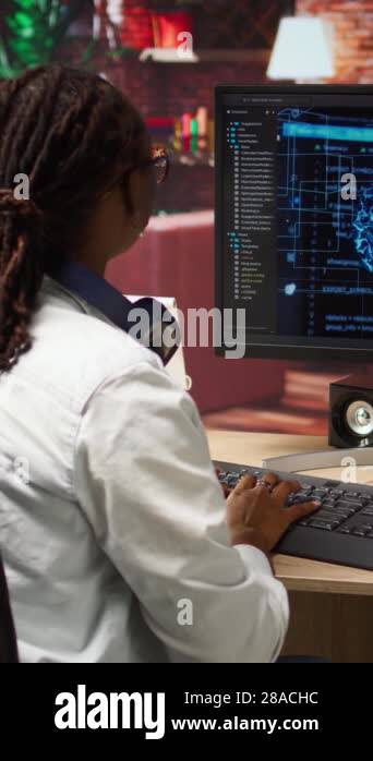 Vertical video Happy programmer celebrating after successfully implementing code using ...