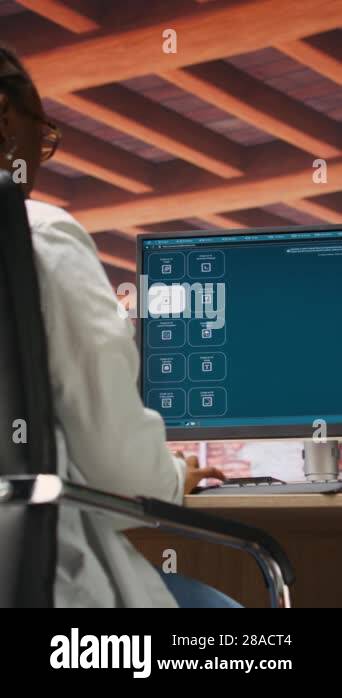 Vertical video Woman at home using generative artificial intelligence website generating videos ...