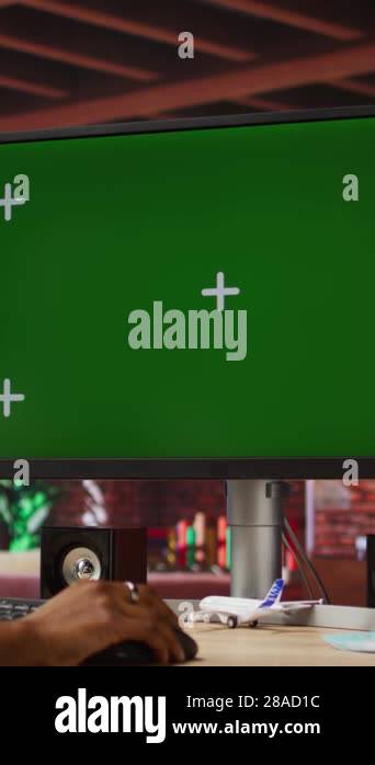 Vertical video Woman at home using green screen PC during job shift ...