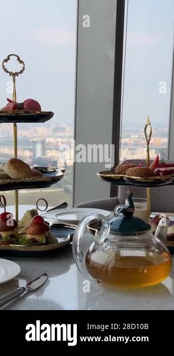 Deliciously afternoon tea setup outdoors. High quality 4k footage Stock ...