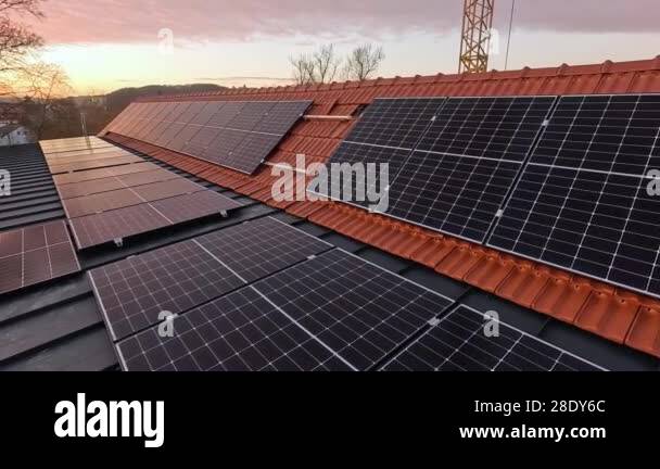 Solar Panels on a High-Rise Rooftop at Sunset Capturing Golden Light ...
