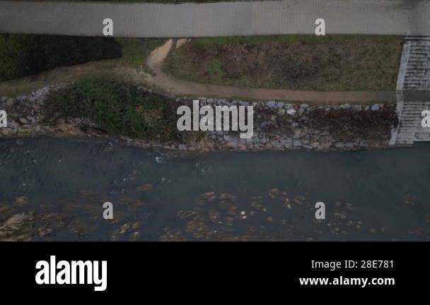 newly created natural embankment by river. benches, terraces, relaxed ...