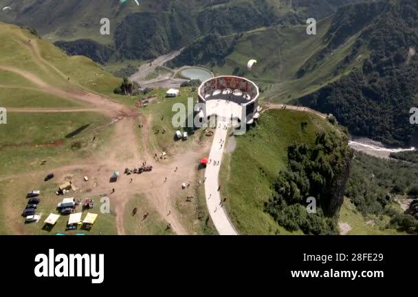 Circular monument with colorful murals on a cliff in Gudauri, Georgia ...