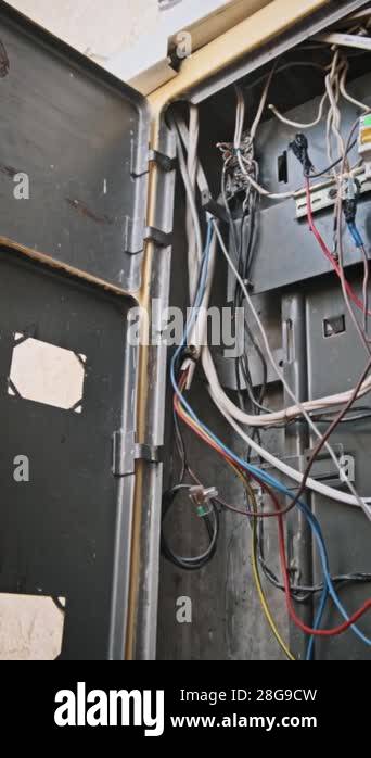 Open electric box showcasing an array of connected cables and wires ...