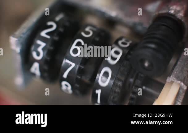 A detailed view of a mechanical counter as it ticks, showcasing the ...