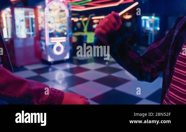 Slowmo closeup of hands of two unrecognizable young friends in casual ...