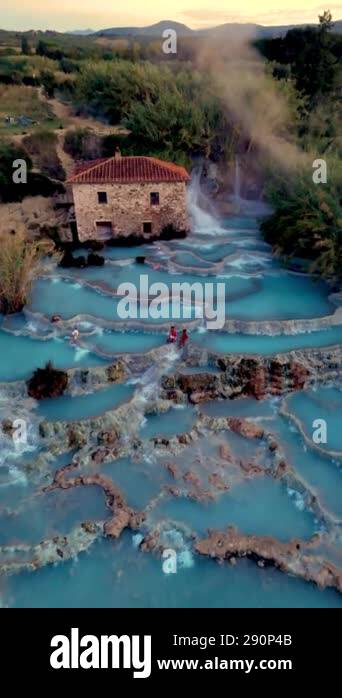 Explore the serene landscape of Italys hot springs, where turquoise ...