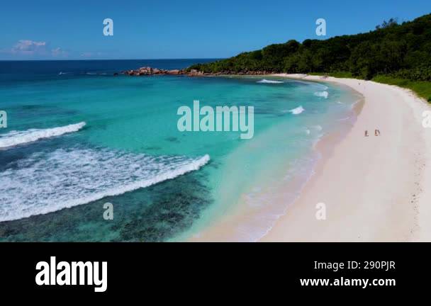 Enjoy a sunny day at the breathtaking beaches of Seychelles, where soft ...