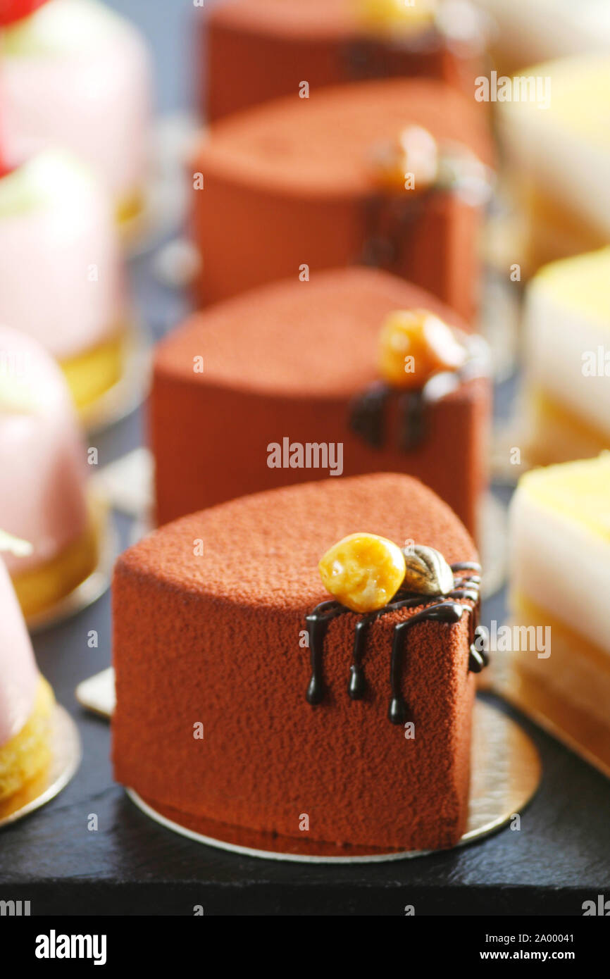 Fancy Chocolate Cakes In A Row Stock Photo - Alamy