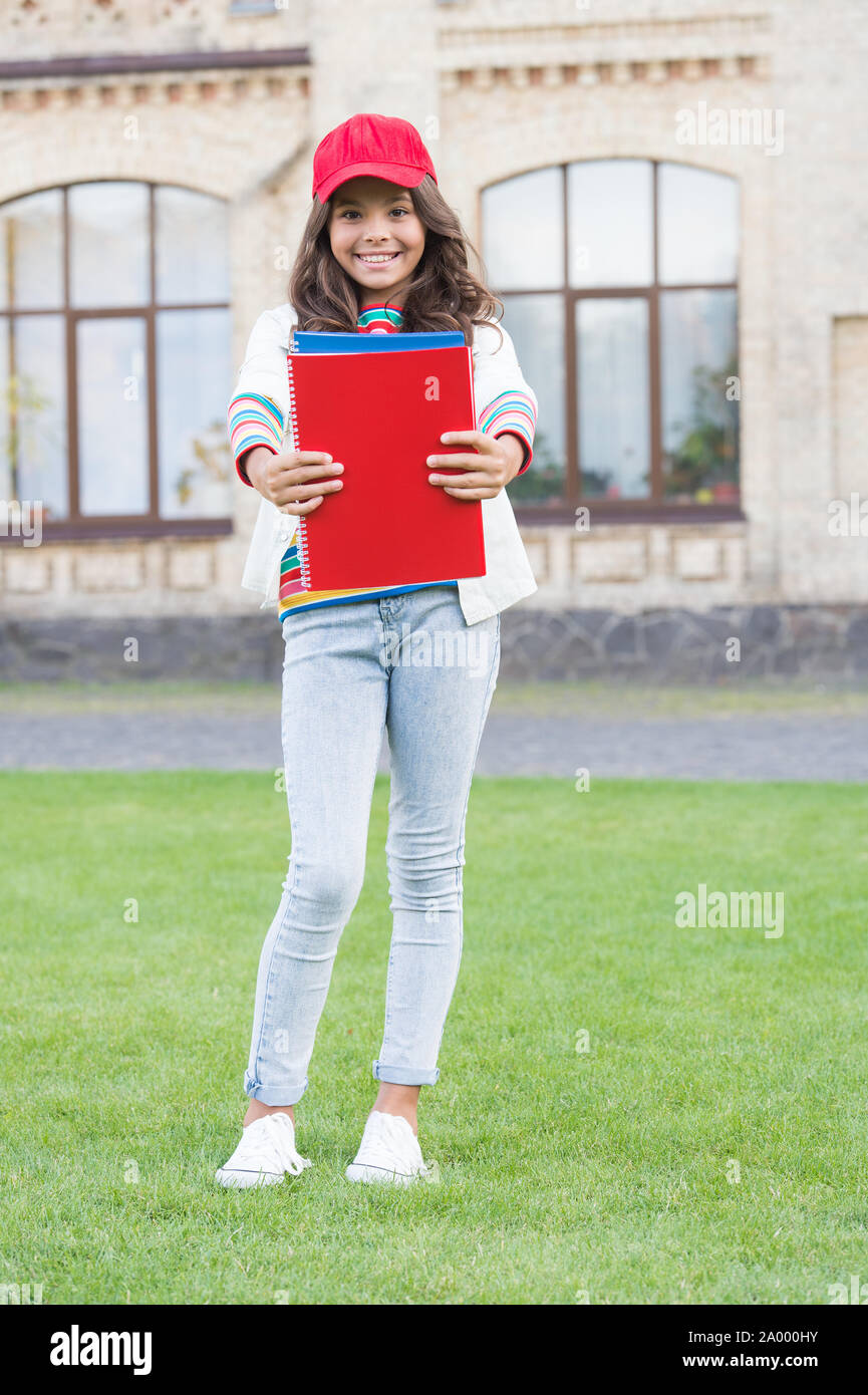 All the knowledge is there in books. Adorable small child sharing her ...