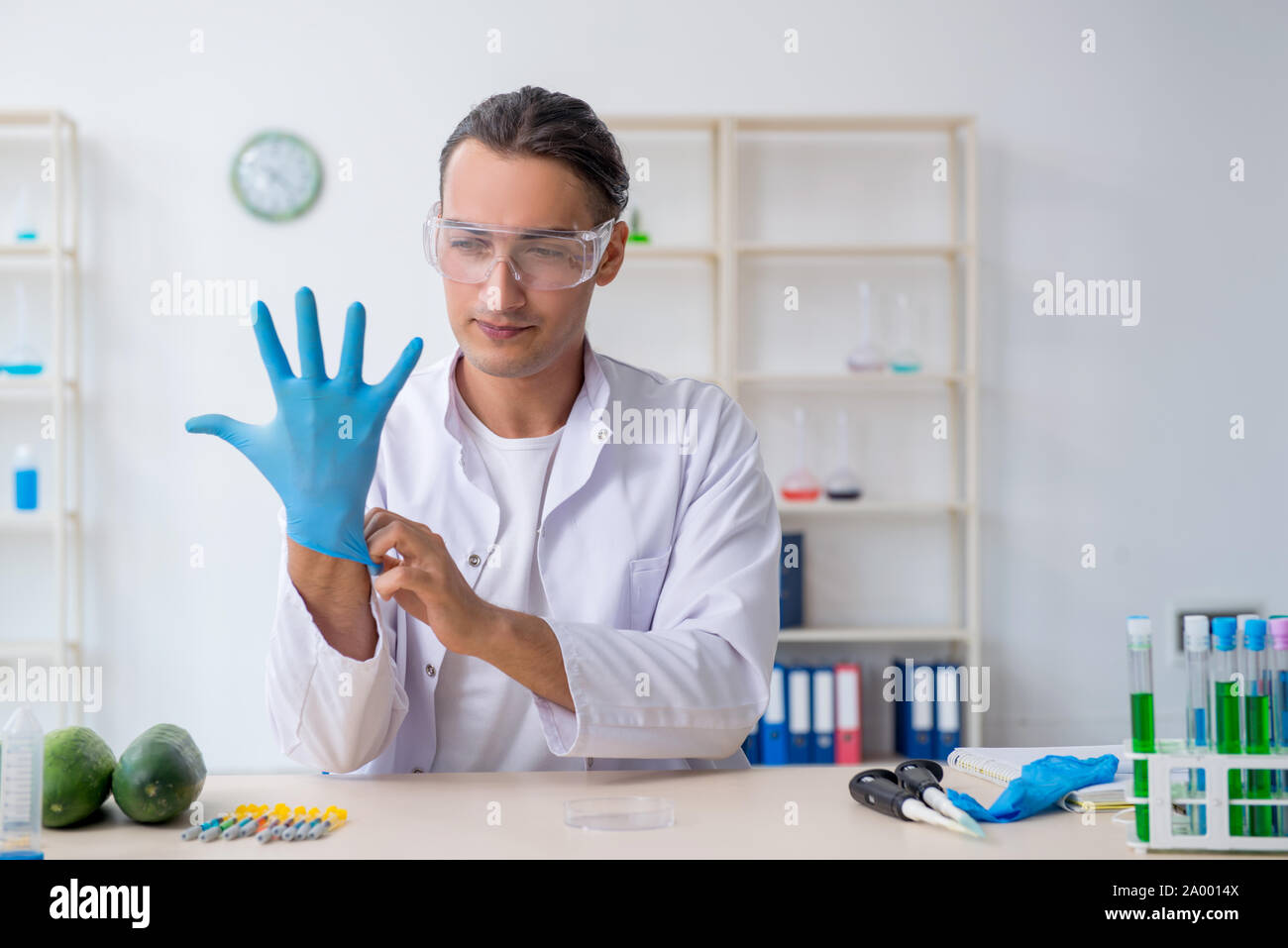 The male nutrition expert testing vegetables in lab Stock Photo - Alamy
