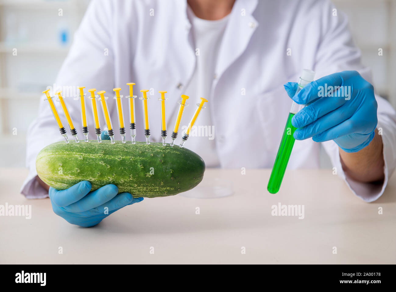 The male nutrition expert testing vegetables in lab Stock Photo - Alamy