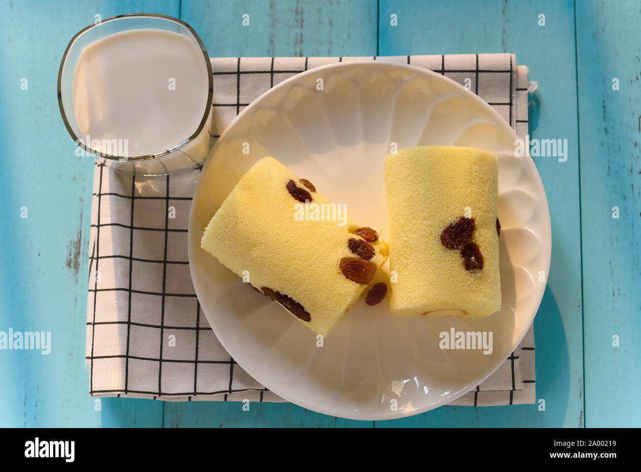 top view cakes with raisin and cup of milk in a sunny morning Stock ...